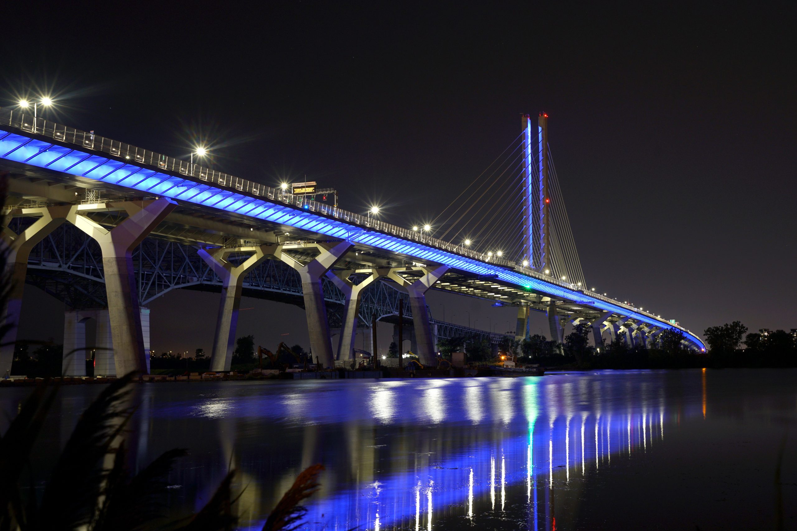 Montreal bridge lit up in blue and green to protect migrating birds
