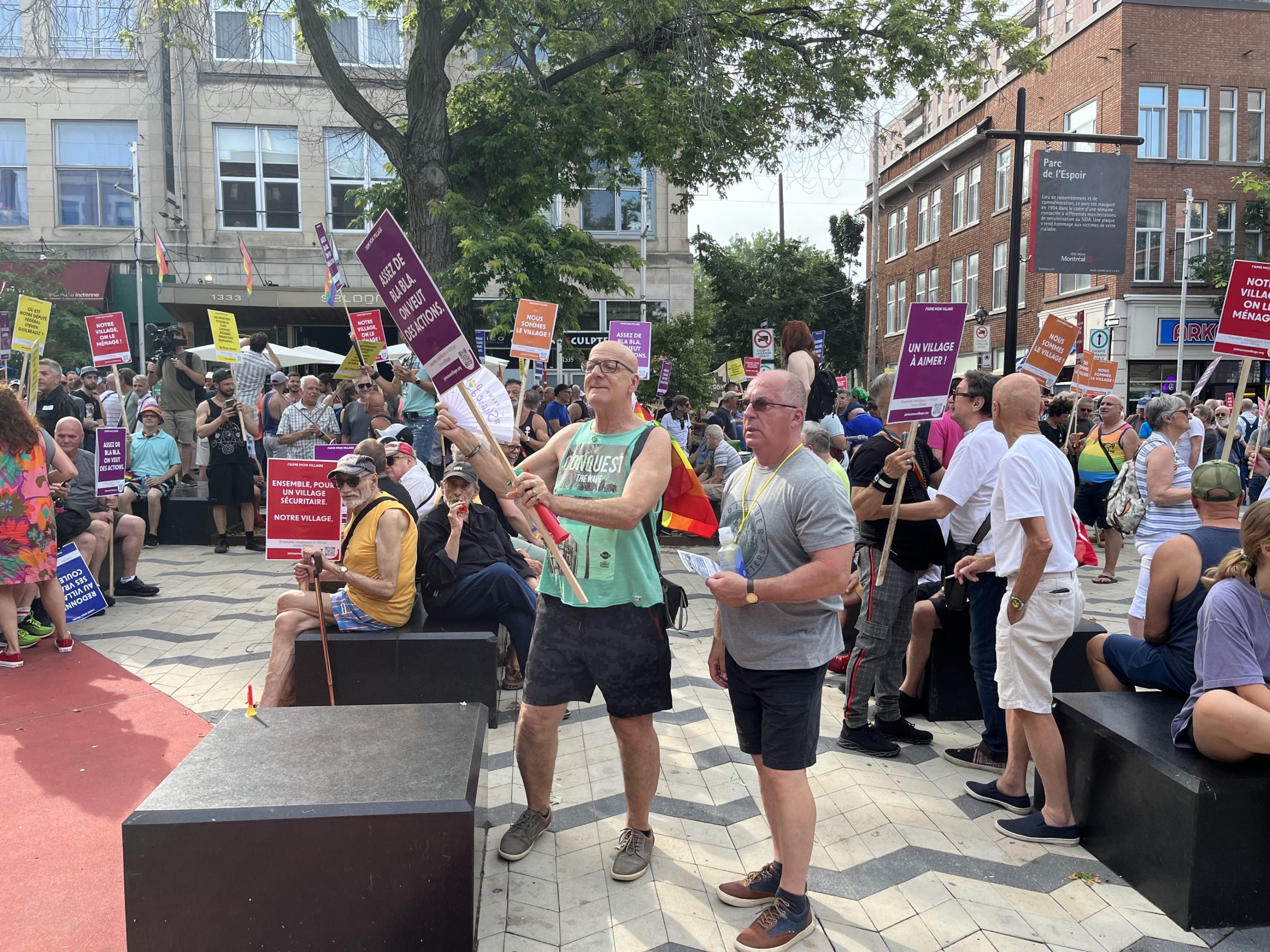 Hundreds rally urging the city to address social issues in the Village