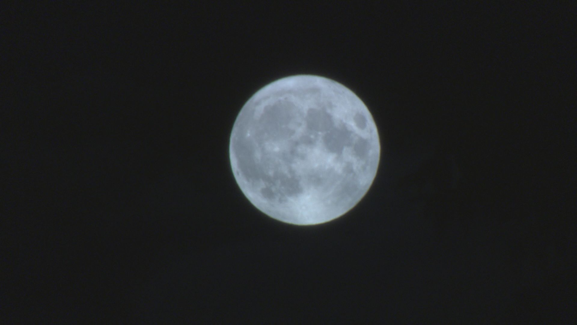 Blue supermoon above the Montreal sky